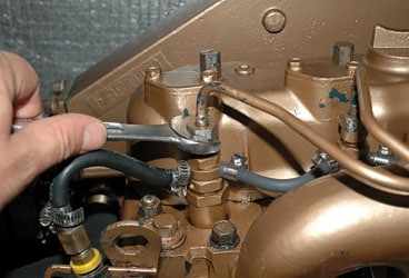 open the fuel line to bleed your diesel fuel system | Cruising World